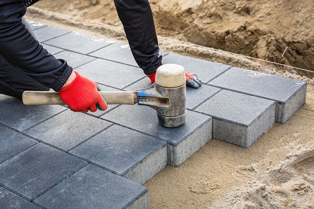 Preventing Problems with Pavers Over Concrete: How-to Guide